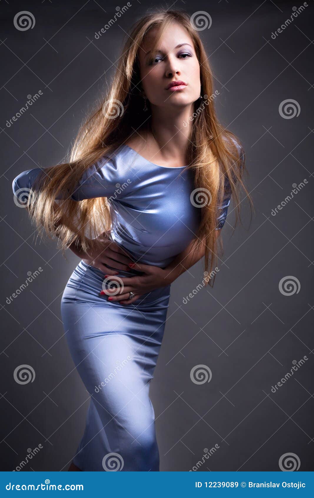 Woman in shiny blue stock image. Image of face, studio - 12239089