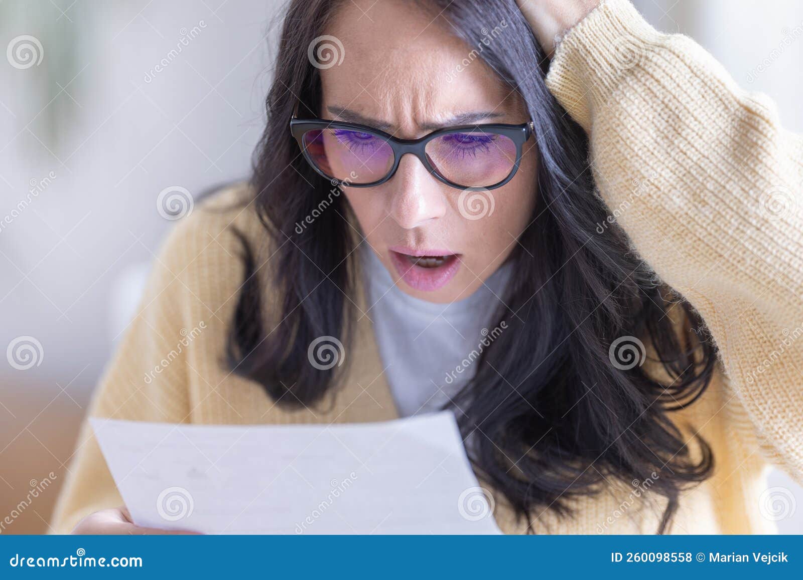 Woman Shocked by the Information she Reads from the Letter Stock Photo ...