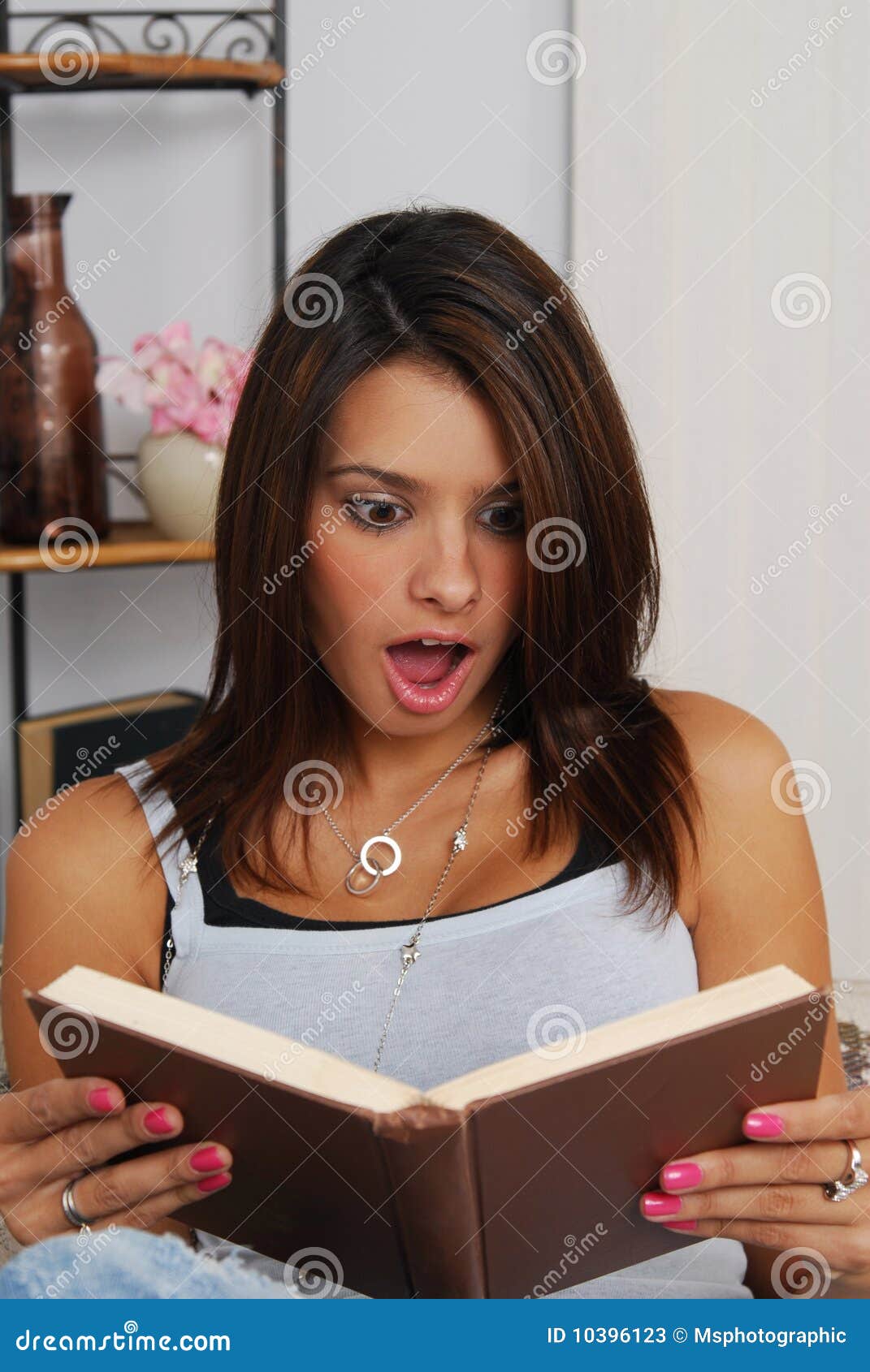 Woman Shocked Reading a Book Stock Image - Image of person, adult: 10396123