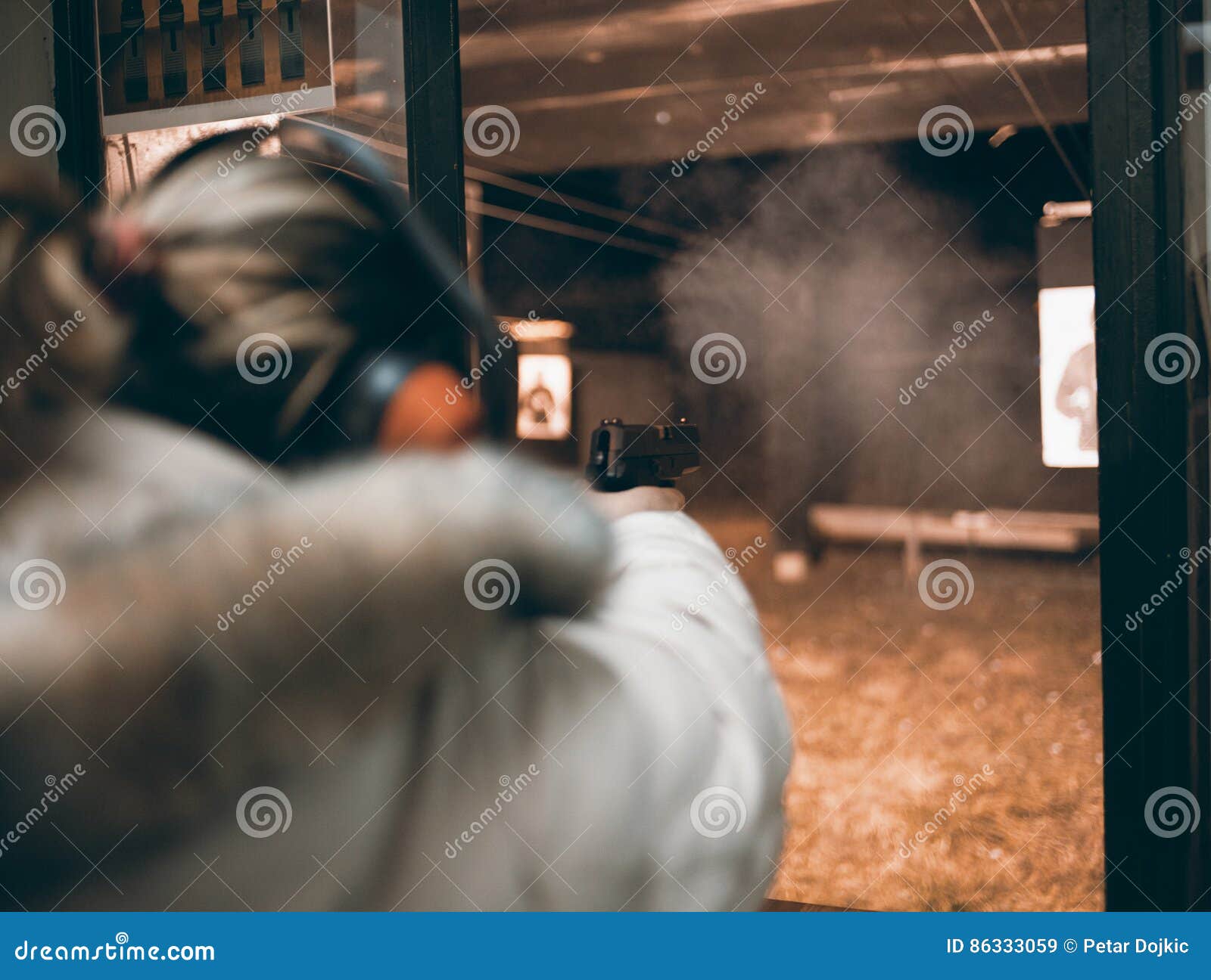 Woman Shooting with Gun at Target in Shooting Range Stock Image - Image ...