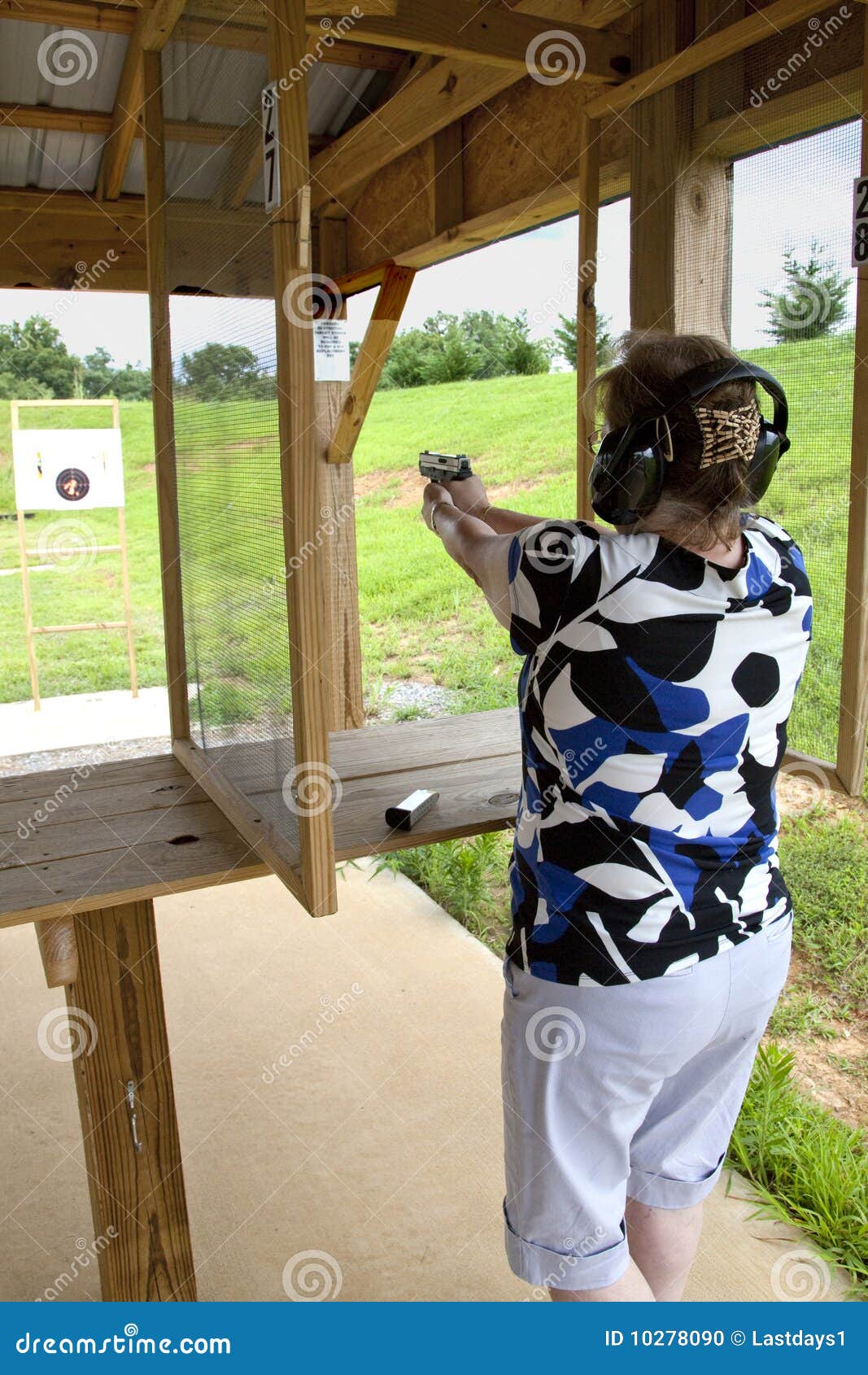 Woman at shooting range stock photo. Image of outdoors - 10278090