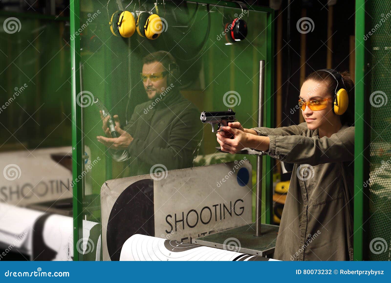 Woman Shoots a Gun at a Shooting Range Stock Photo - Image of jericho ...