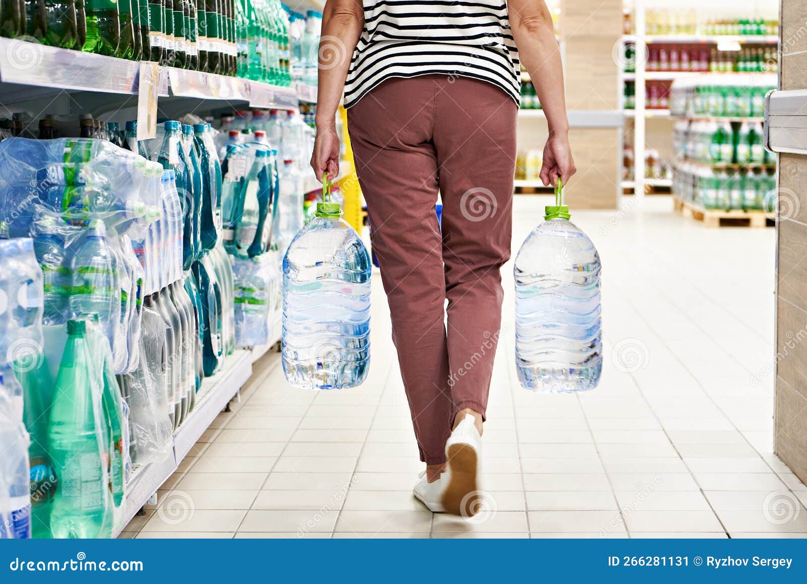 Woman with Bottles of Water in Store Stock Image - Image of retail ...