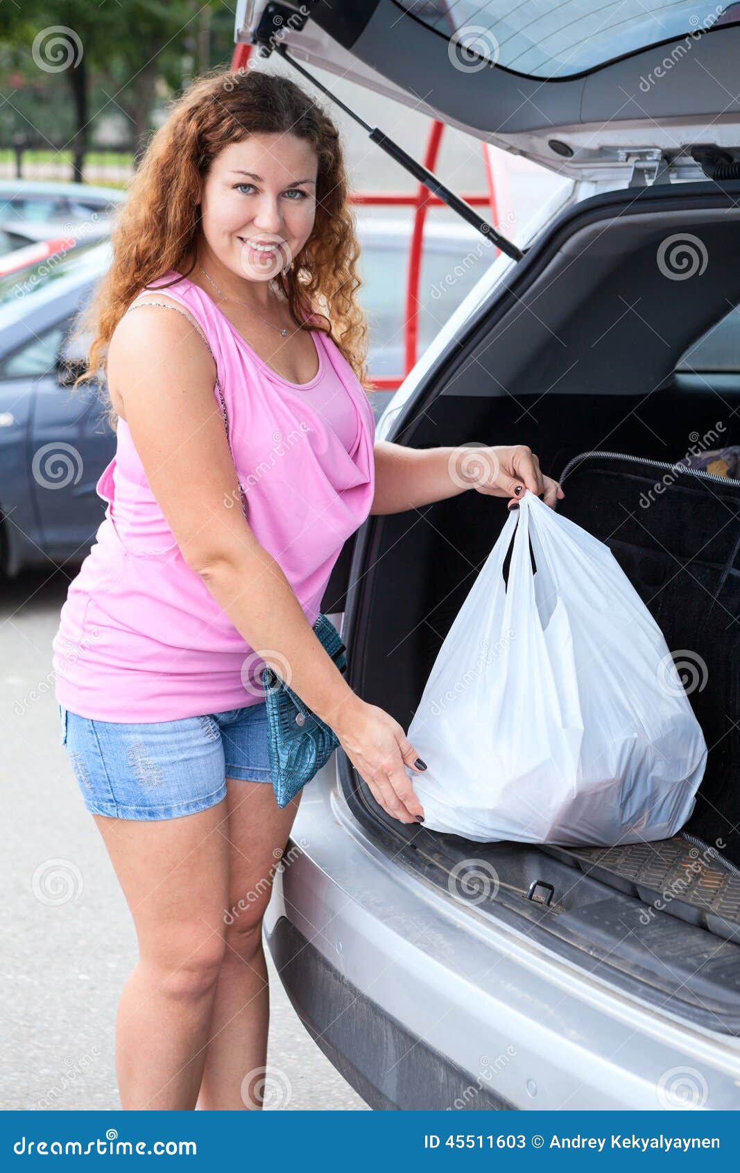Woman Shopper Loading Bag in Trunk of Her Suv Stock Image - Image of ...