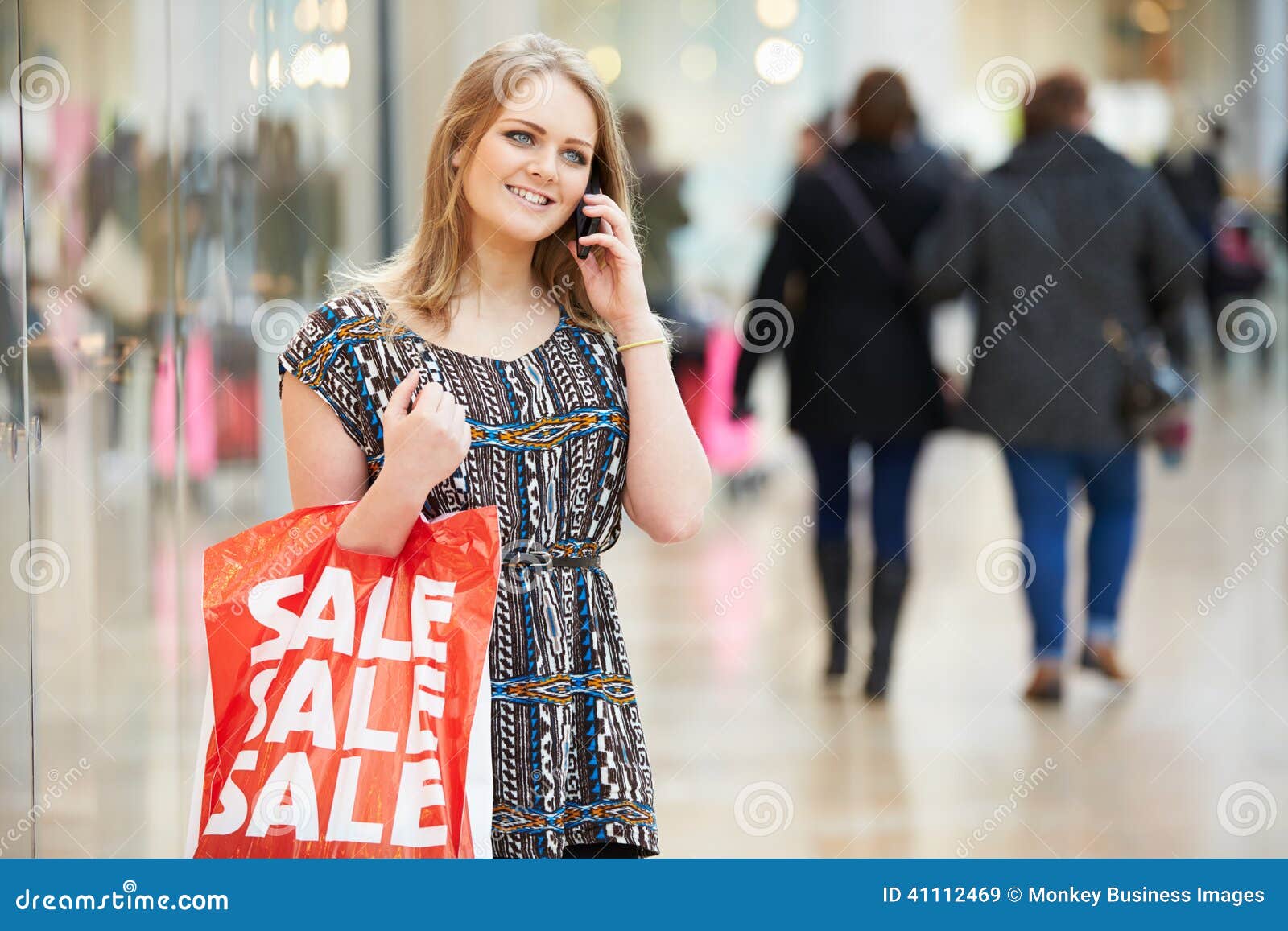 Woman in Shopping Mall Using Mobile Phone Stock Image - Image of ...