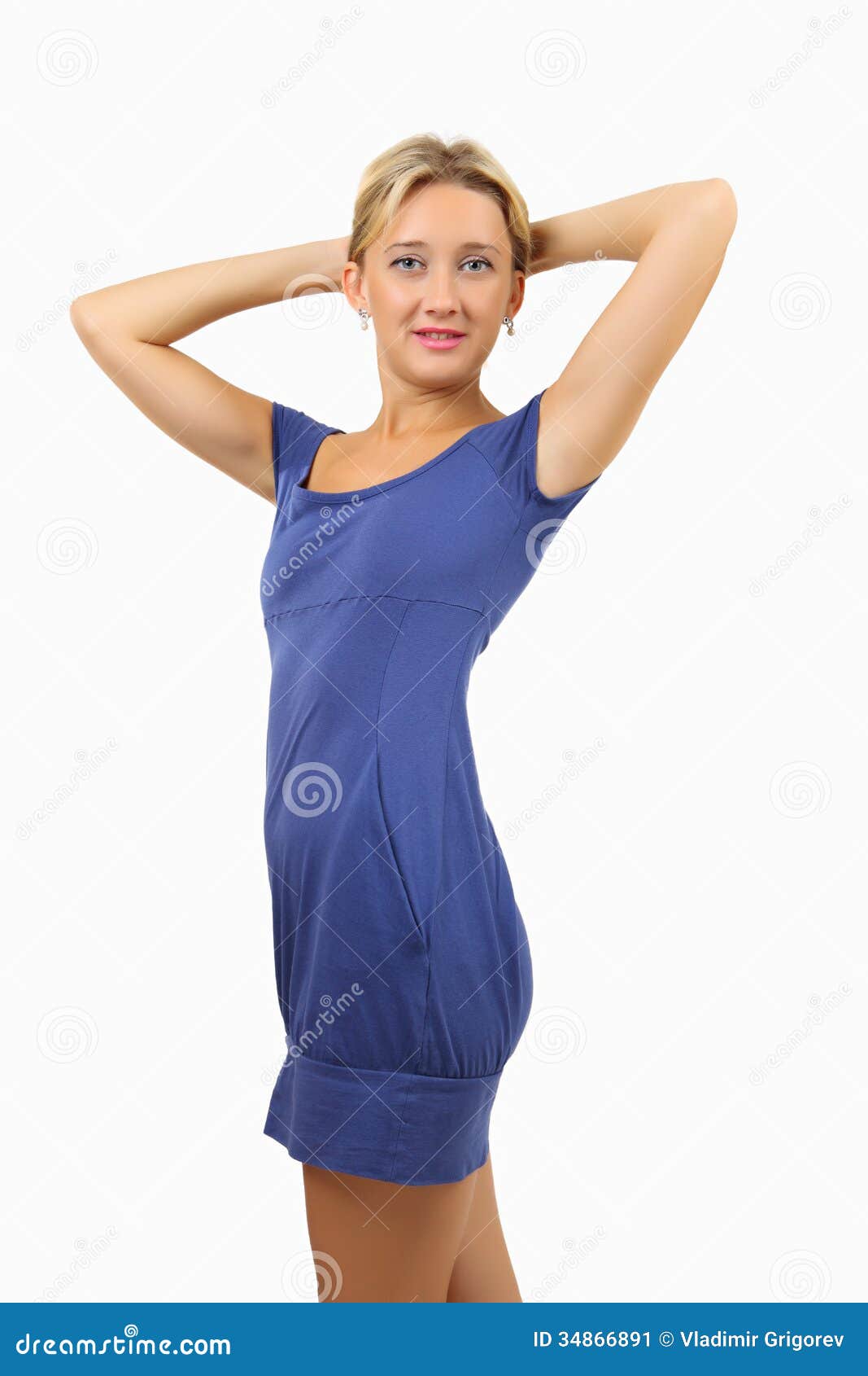 Woman In Short Skin Tight Blue Dress Holds Hands Behind Her Head Stock Image Image Of Hand