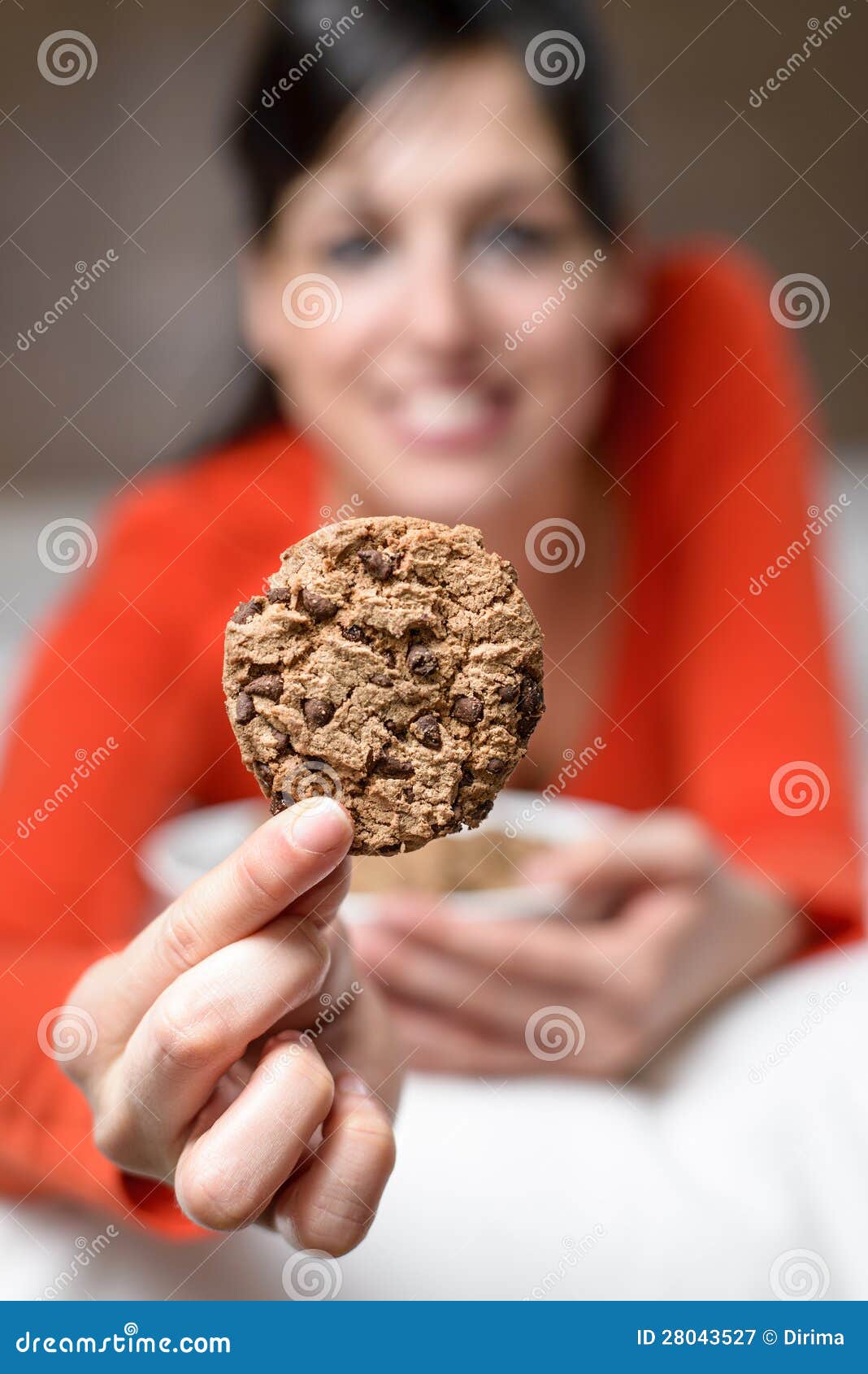 Woman Showing Cookie in Bed Stock Image - Image of hispanic, brunette ...