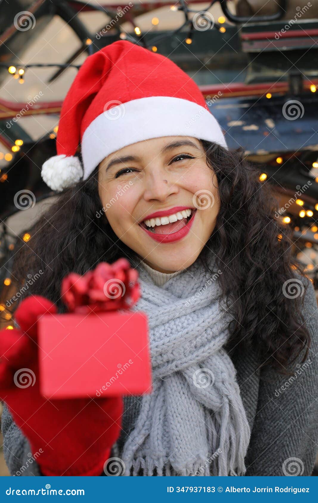Woman Showing a Cute Christmas Present Stock Image - Image of happiness ...