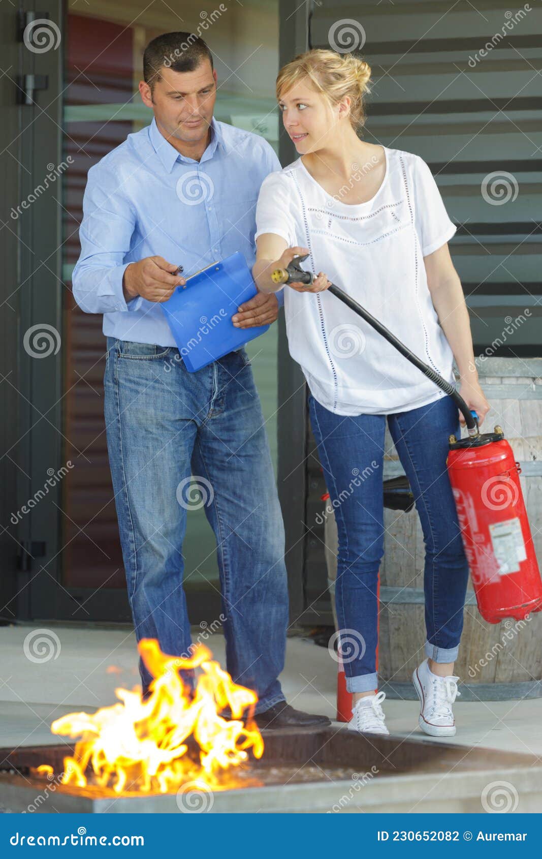 Woman with Showing How To Operate Fire Extinguisher Stock Photo - Image ...