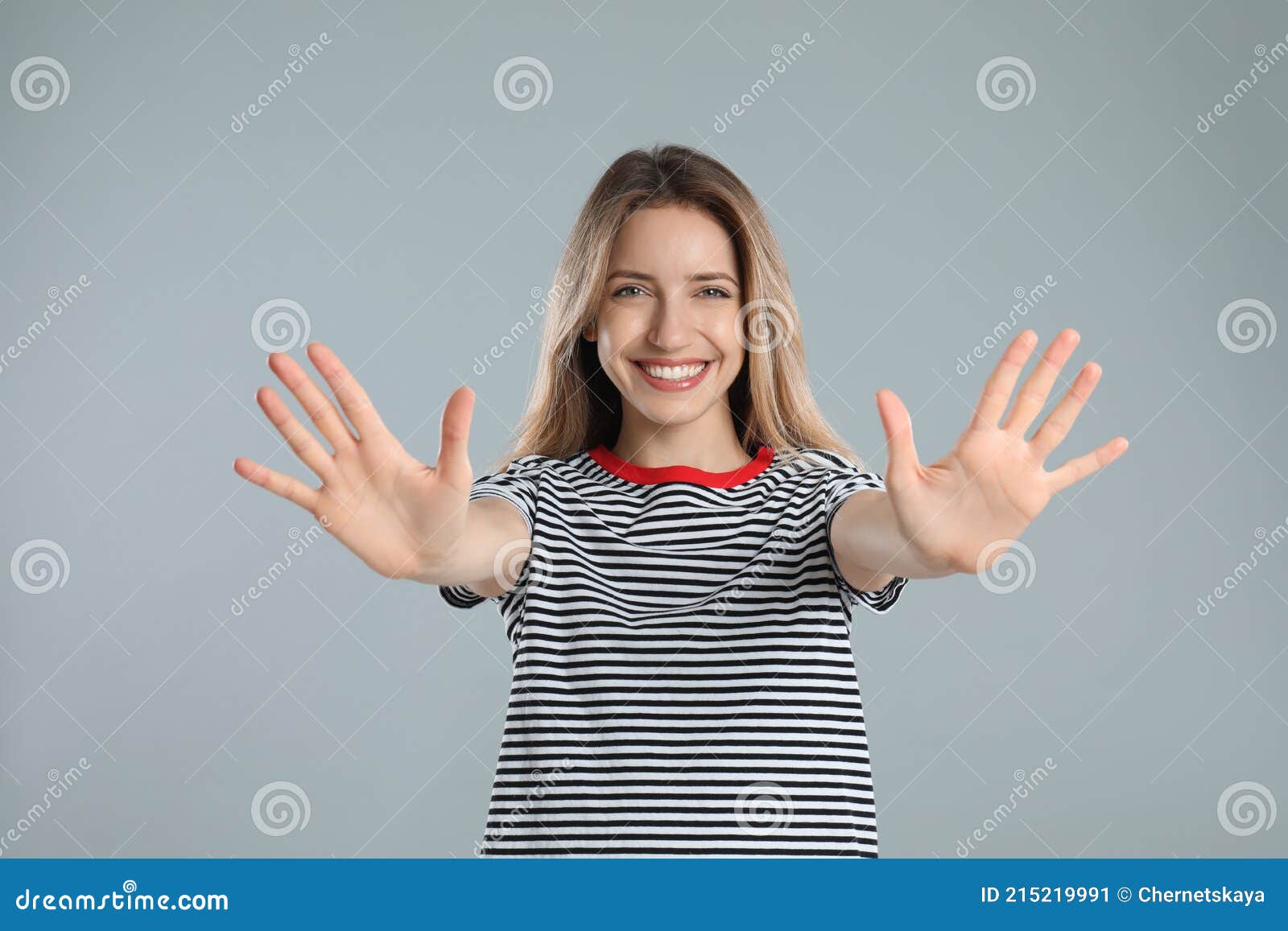 Woman Showing Number Ten with Her Hands on Light Grey Background Stock ...