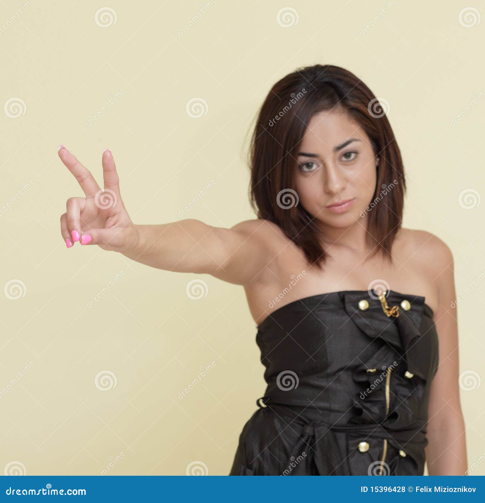 Woman showing a peace sigh stock photo. Image of cute - 15396428