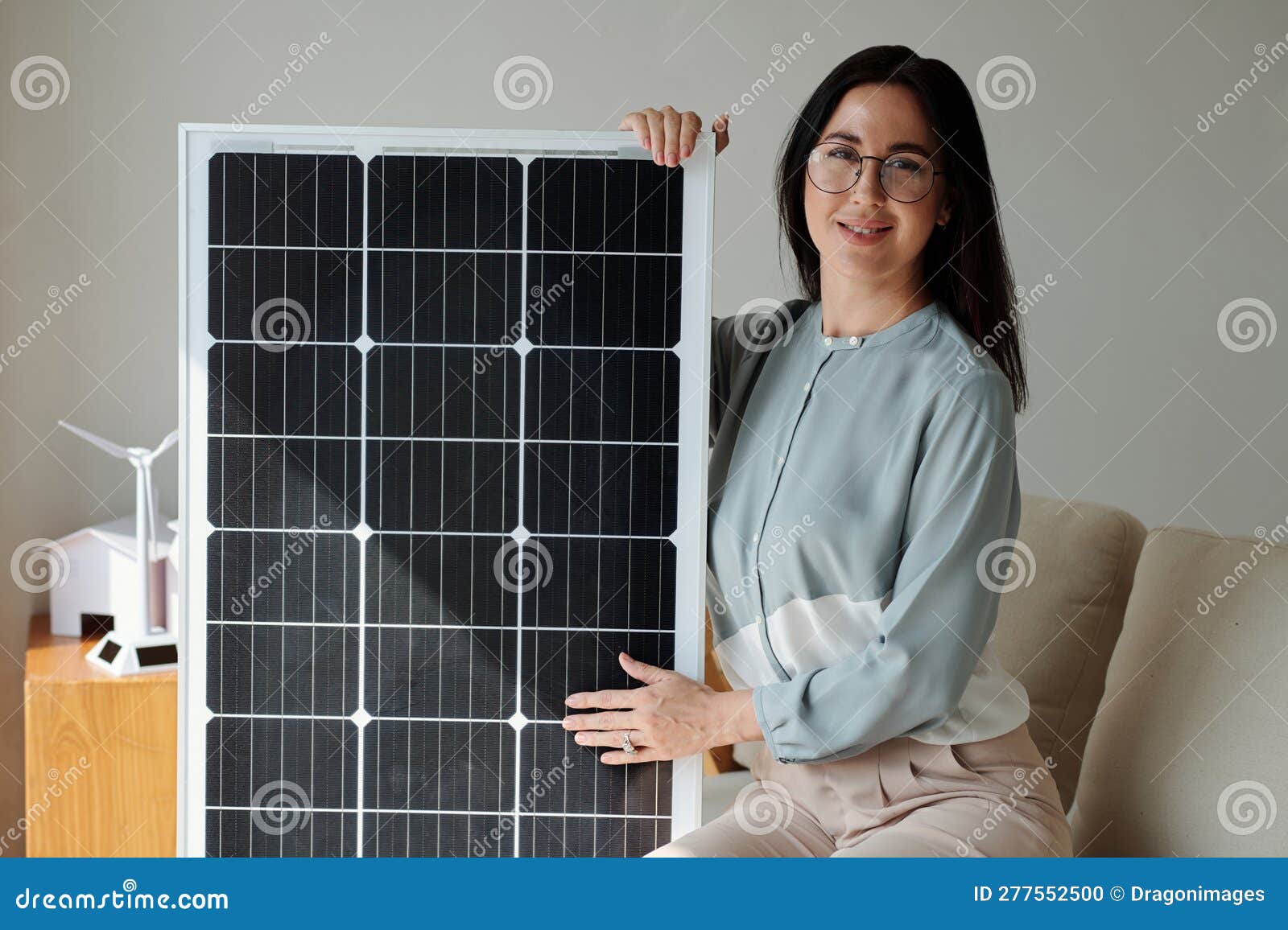 Woman Showing Solar Panel stock photo. Image of resource - 277552500