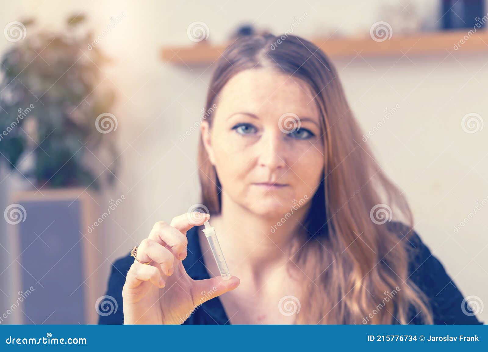 Woman is Showing a Test Tube with Solution of a Self-testing Kit Stock ...