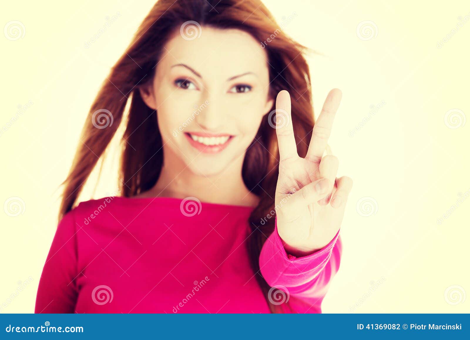 Woman showing victory sign stock photo. Image of hand - 41369082