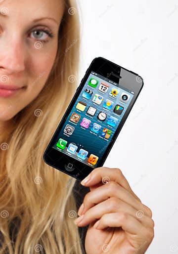 Woman shows iphone 5 editorial photo. Image of friendly - 26588366
