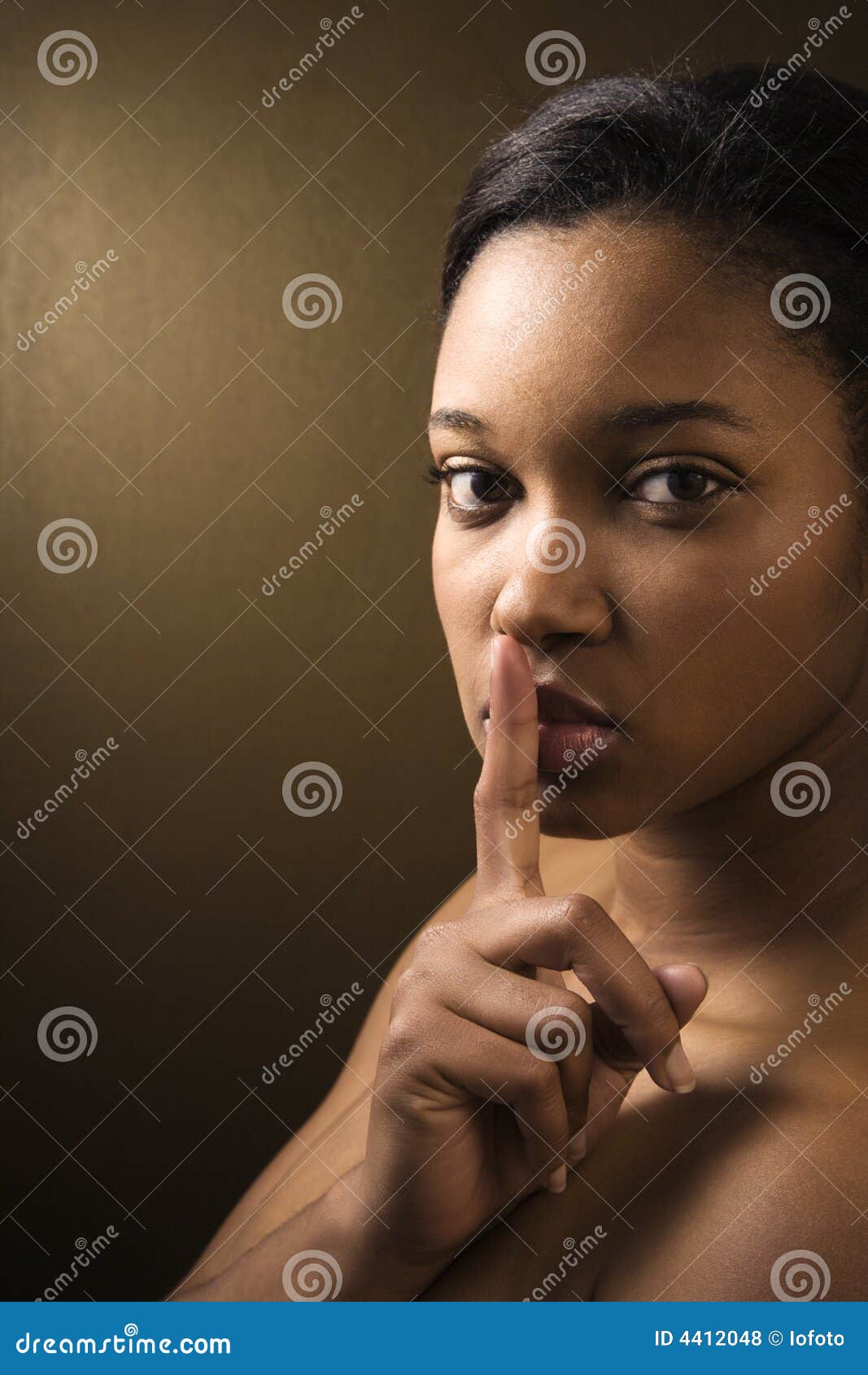 Woman shushing viewer. stock photo. Image of yellow, years - 4412048