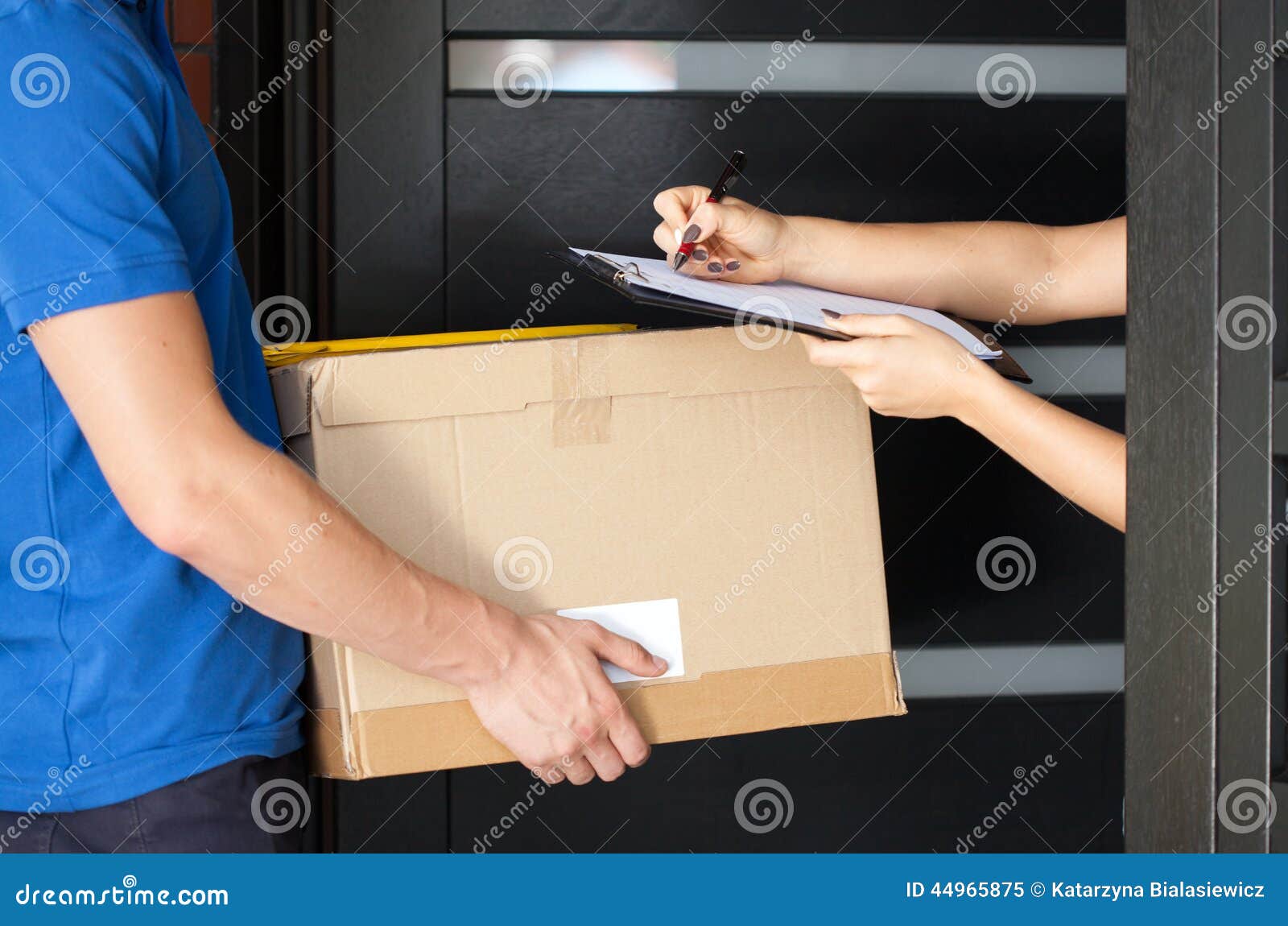 Woman Signing Parcel Delivery Papers Stock Image - Image of home, post ...