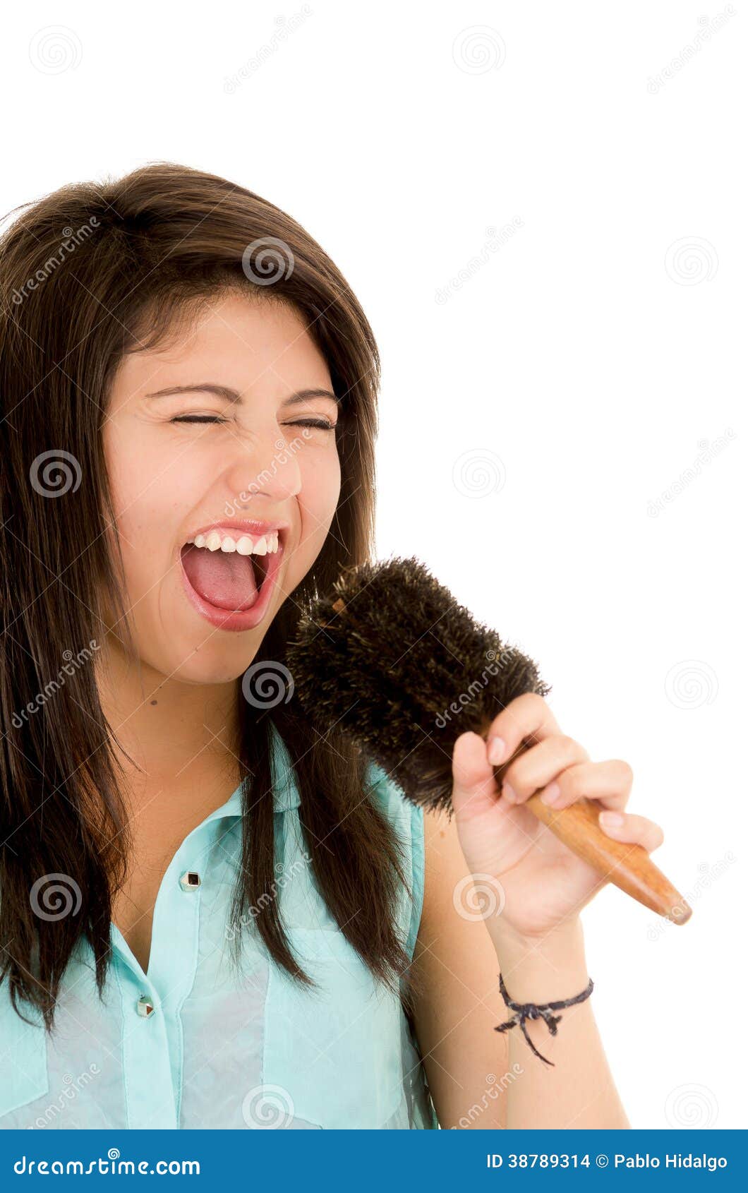 Woman singing into brush stock photo. Image of cute, adult - 38789314