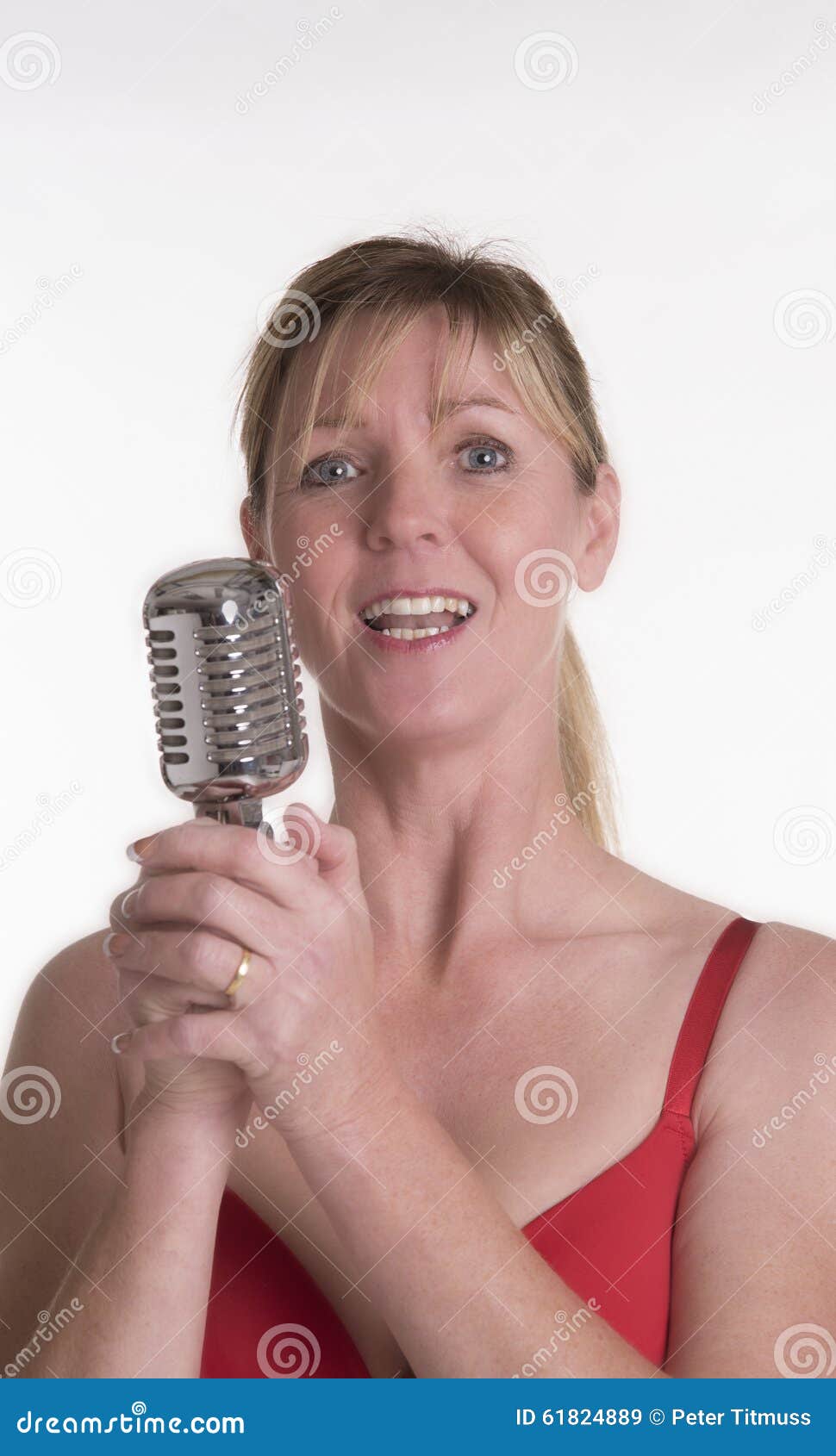 Woman Singing with a Chrome Microphone Stock Image - Image of presenter ...