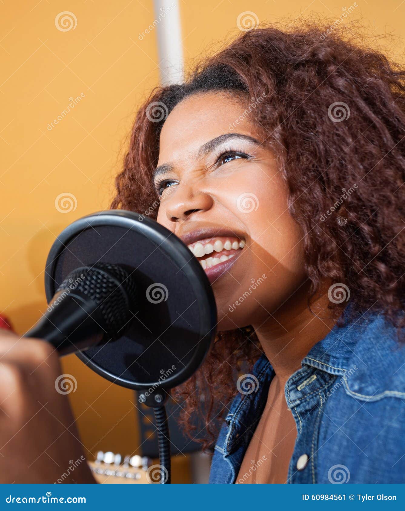 Woman Singing while Holding Microphone in Stock Image - Image of ...