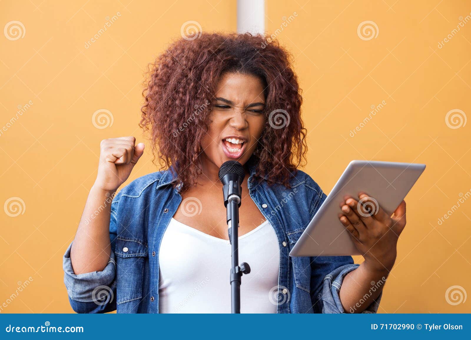 Woman Singing while Holding Tablet Computer Stock Photo - Image of ...