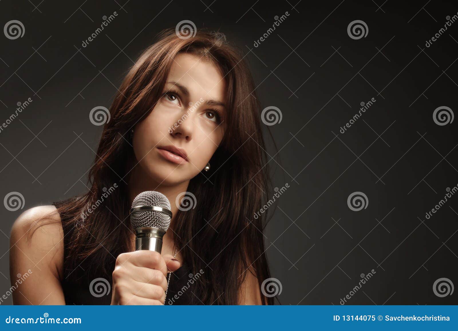 Woman Singing into Microphone Stock Image - Image of indoors ...