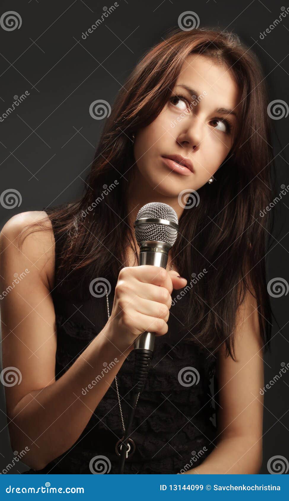 Woman Singing into Microphone Stock Image - Image of entertainer, hold ...