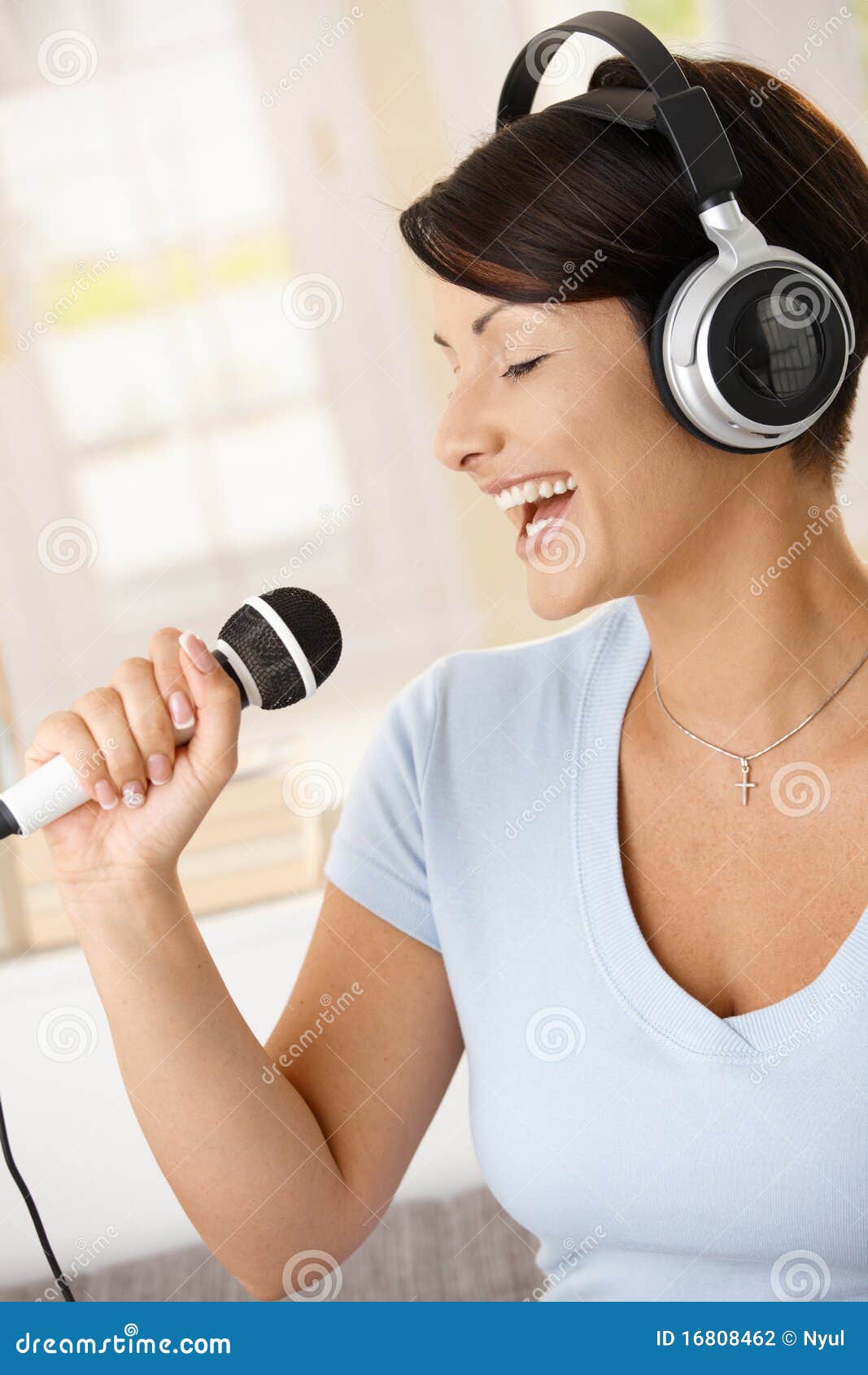 Woman Singing with Microphone Stock Photo - Image of headset, clothing ...