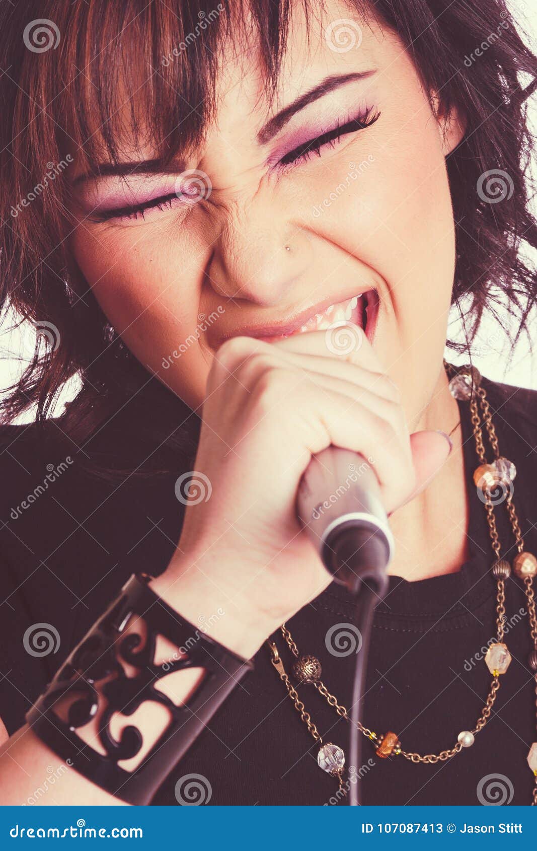 Woman Singing into Microphone Stock Image - Image of karaoke ...