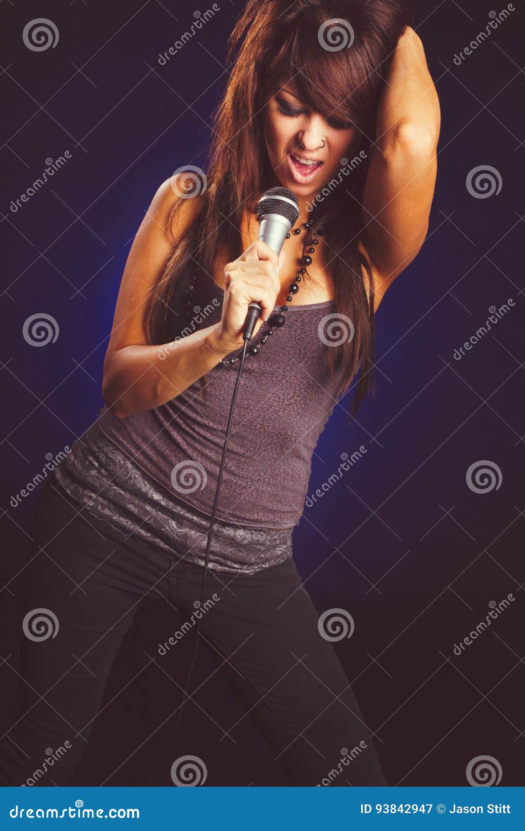 Woman Singing into Microphone Stock Image - Image of singing, female ...