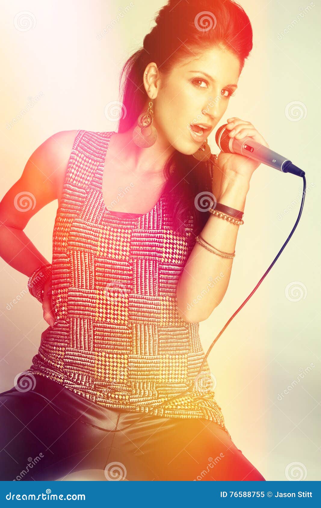 Woman Singing with Microphone Stock Image - Image of kneeling, pants ...