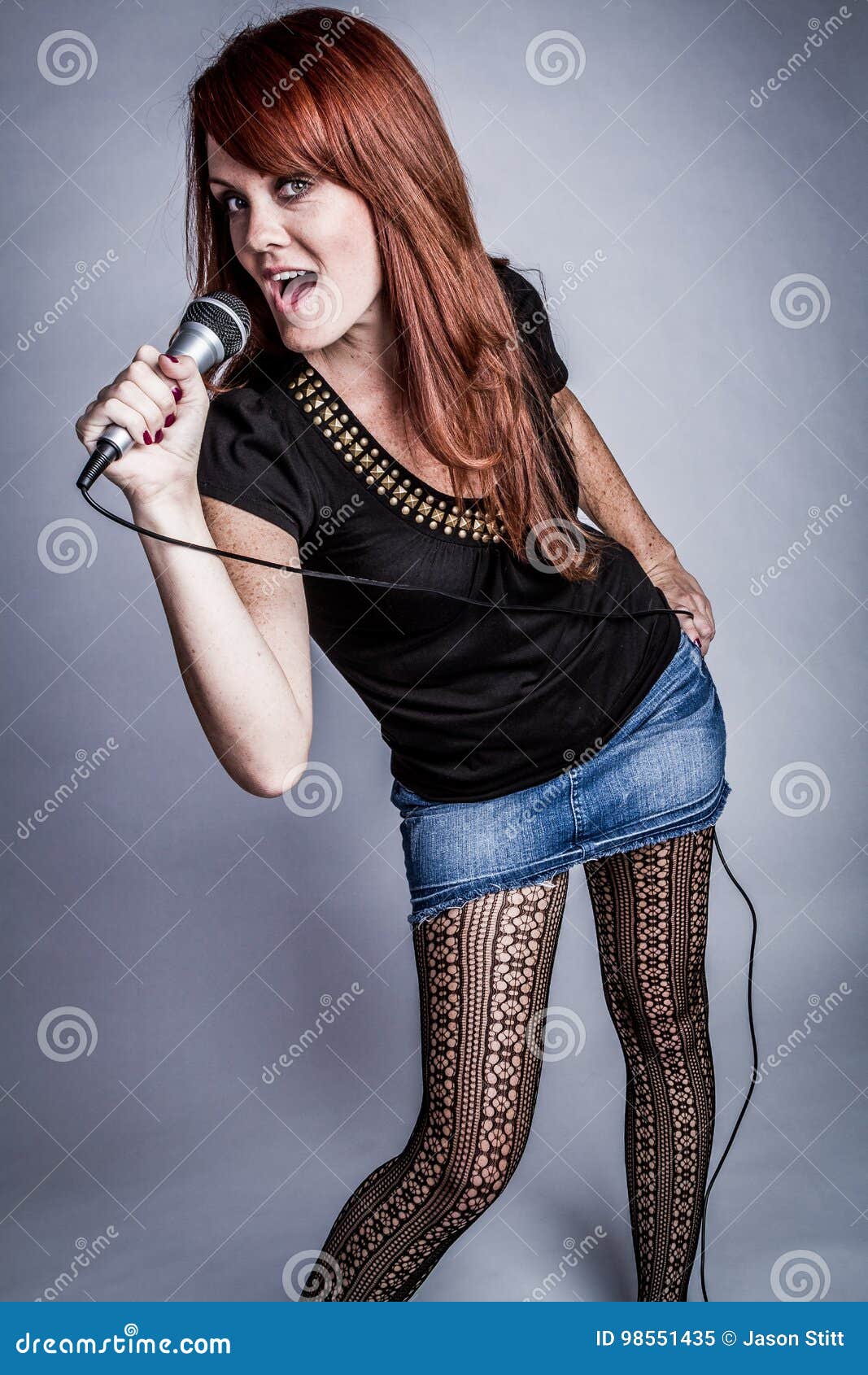Woman Singing with Microphone Stock Image - Image of holding, rocker ...