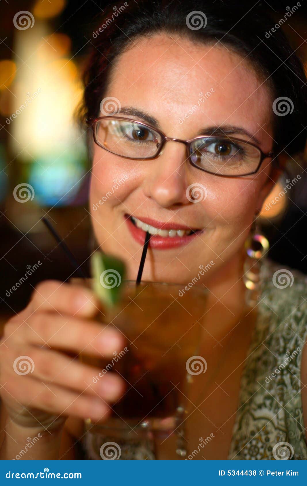 Woman sipping cocktail stock photo. Image of glasses, restaurant - 5344438