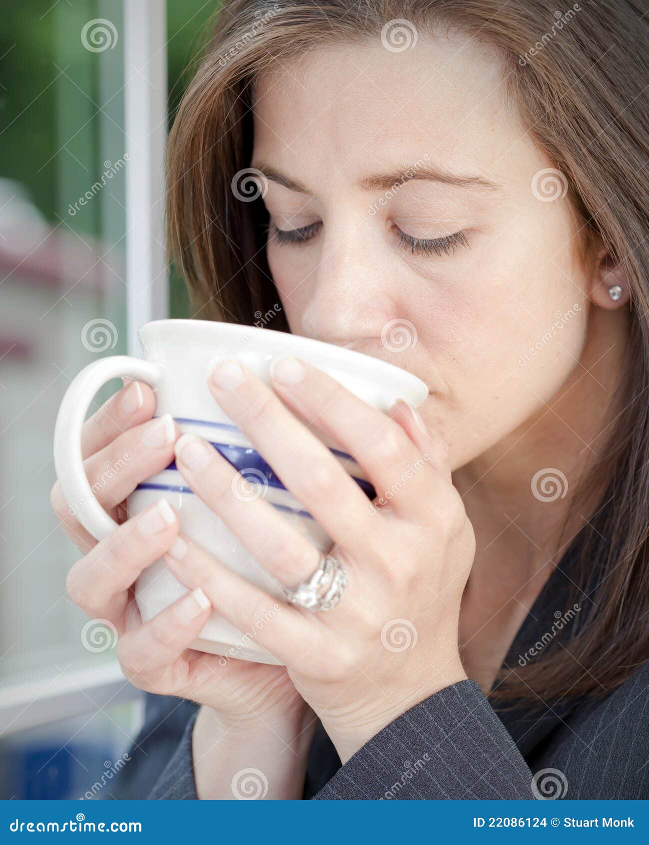 Woman sipping coffee stock photo. Image of businessperson - 22086124