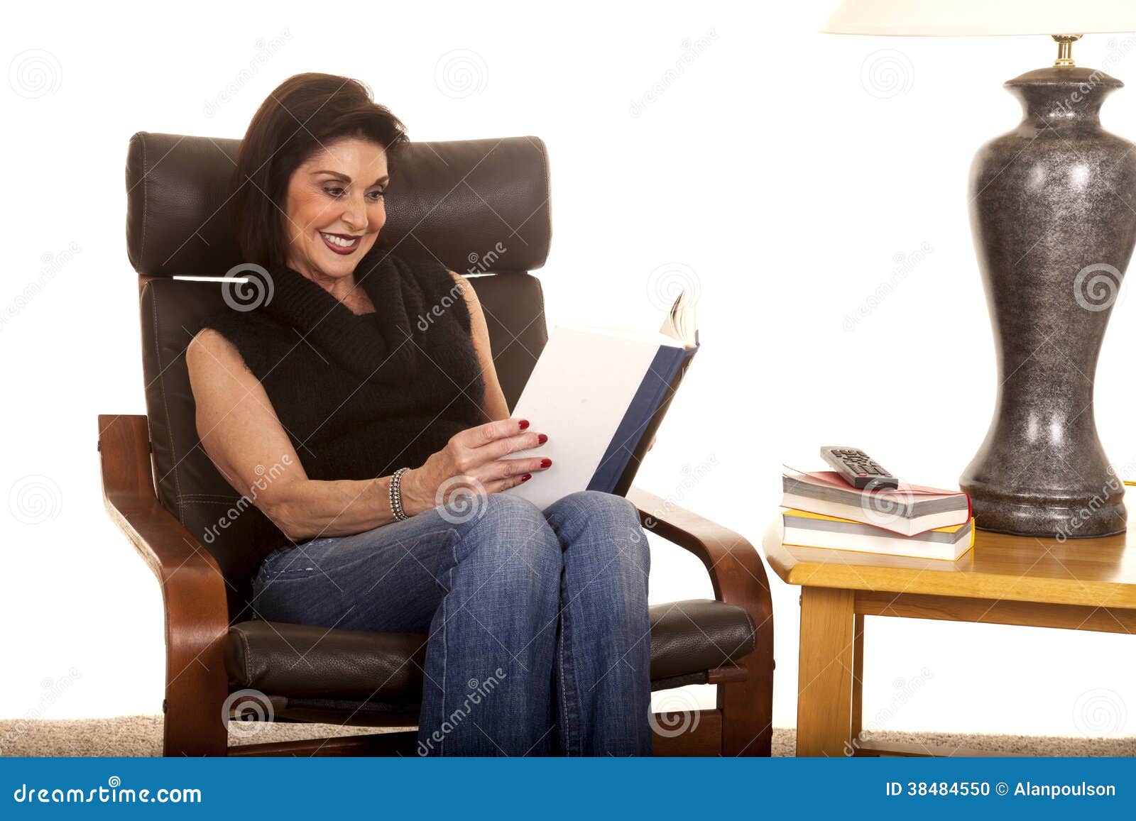 Woman sit and read by lamp stock photo. Image of expression - 38484550
