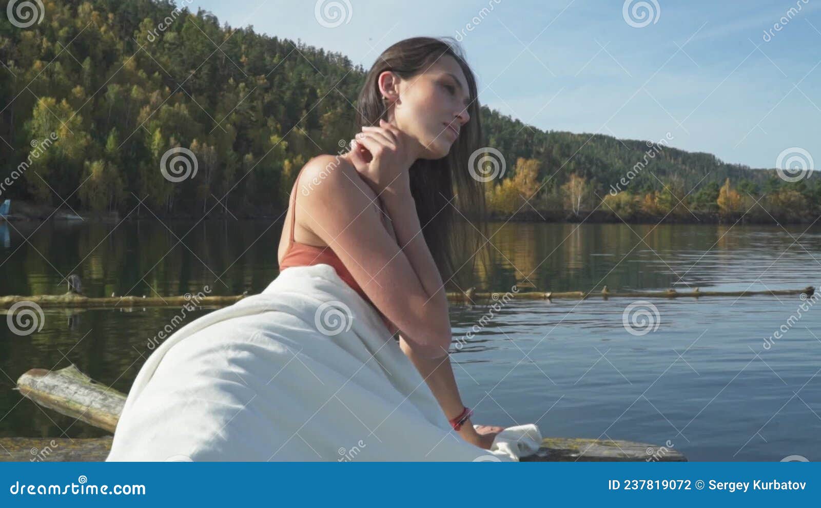 Woman Sit On A Sunbed In Sunglasses And Swimming Suit Girl Rest On A