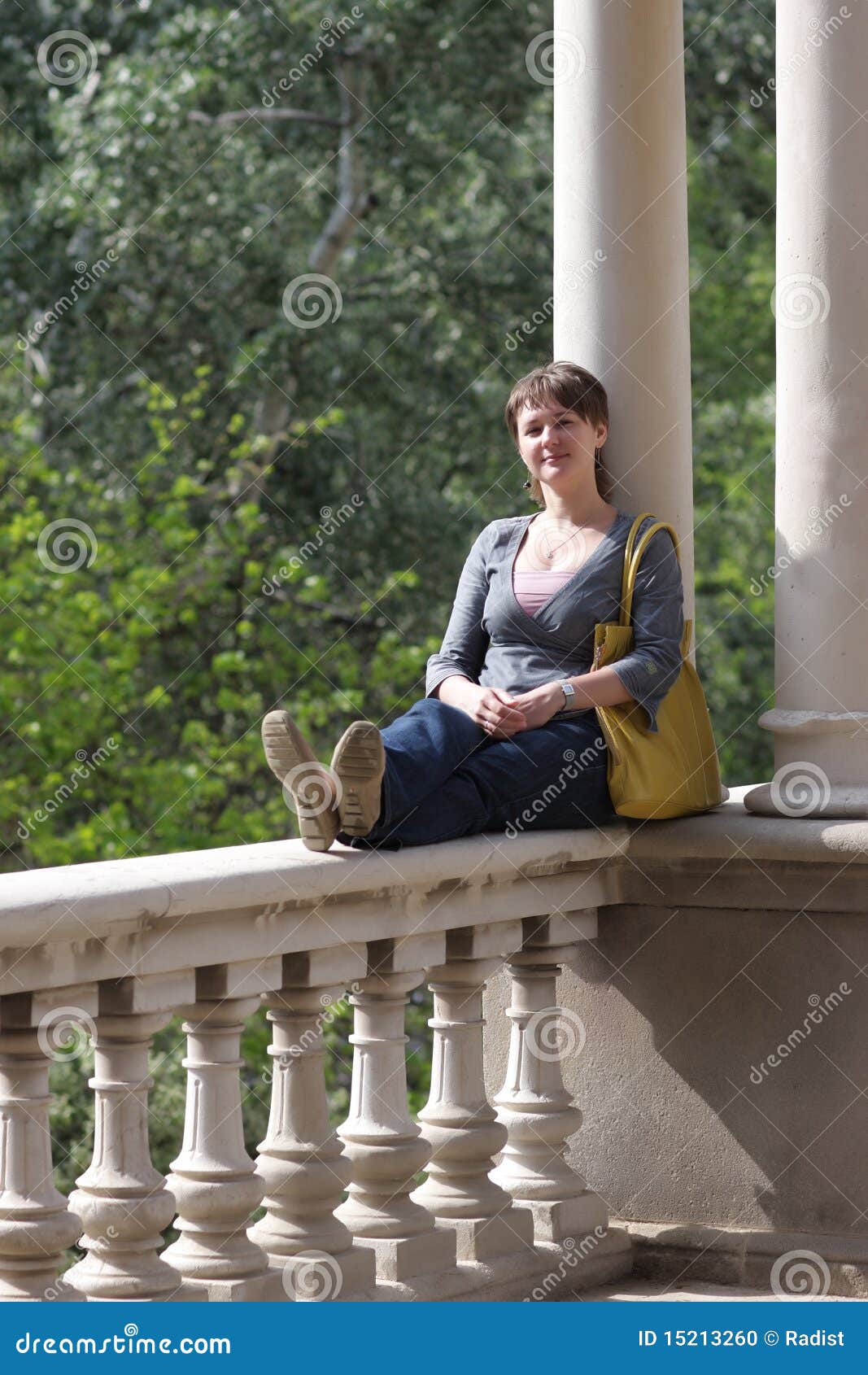 Woman Sits on Balcony Railing Stock Photo - Image of relaxation, green ...
