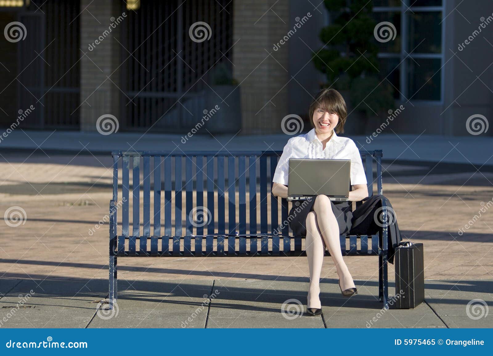 Woman Sits on a Bench with Her Laptop - Horizontal Stock Image - Image ...
