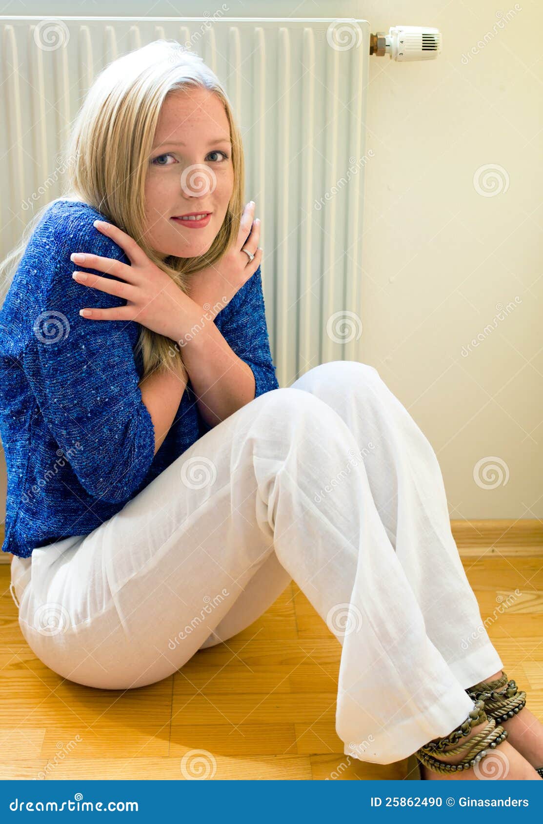 Woman Sits in Front of Radiators Stock Photo - Image of district ...