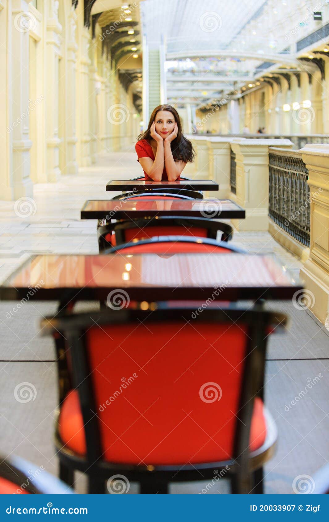 Woman Sits at Little Table in Cafe Stock Image - Image of indoors ...