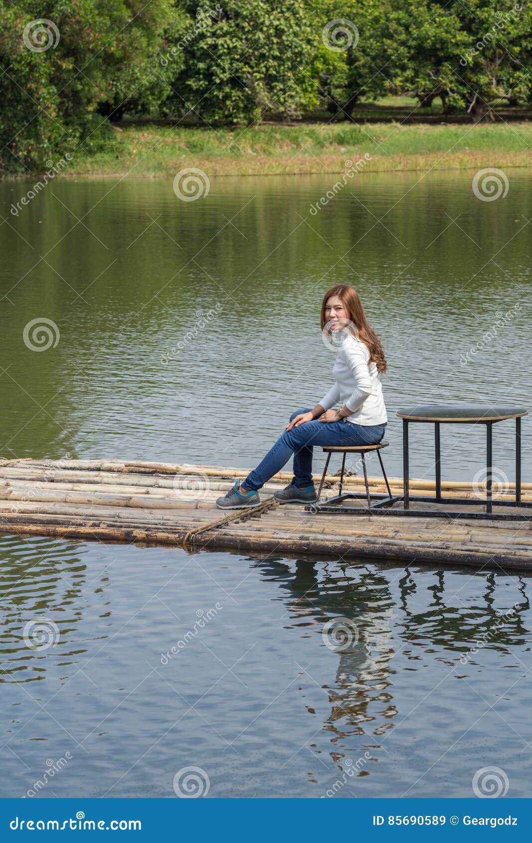 Woman Sitting on a Bamboo Raft in River Stock Image - Image of ...