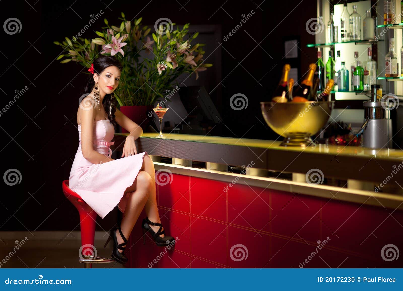 Woman sitting at the bar stock photo. Image of light - 20172230