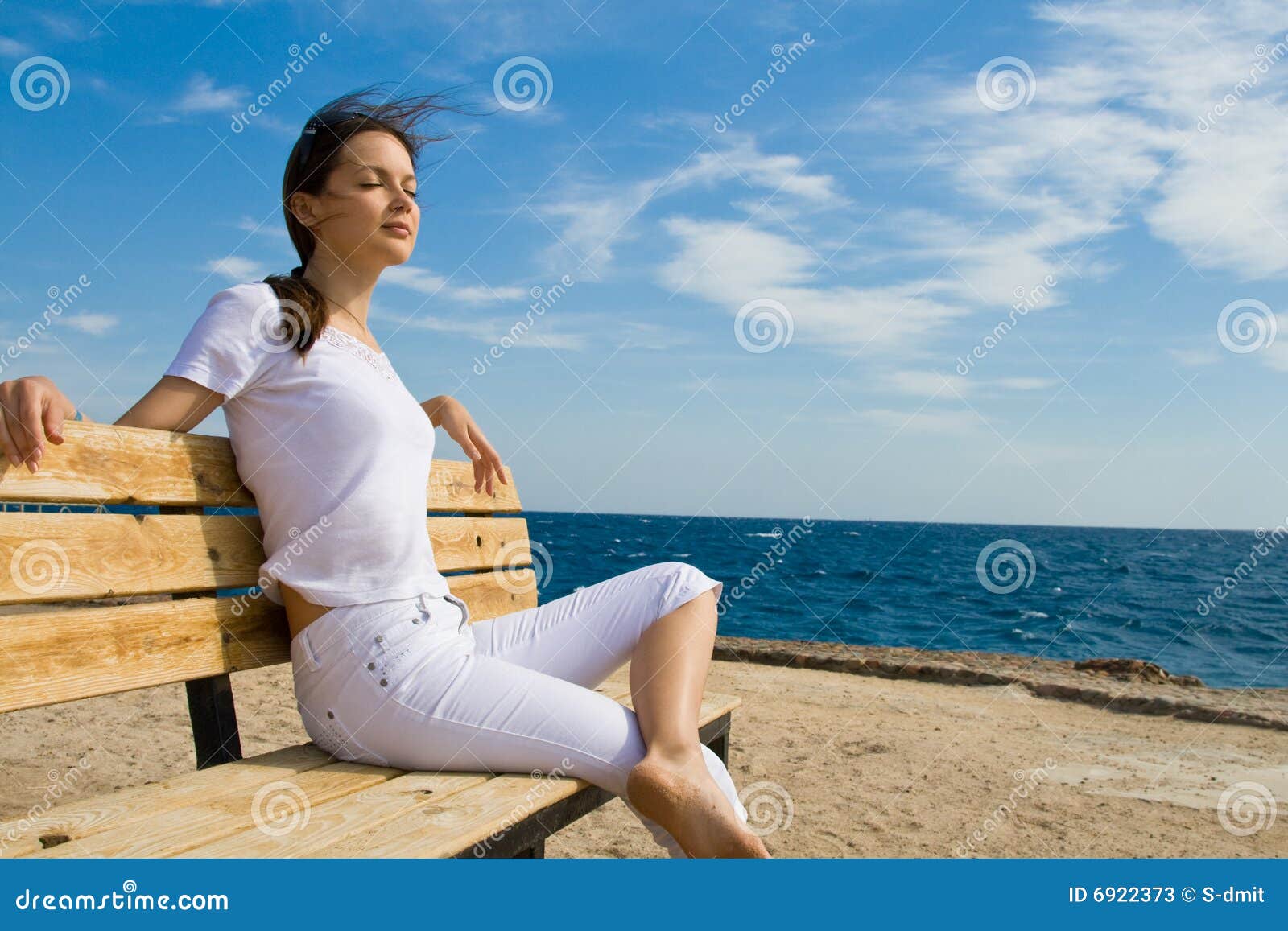 Woman sitting on a bench stock image. Image of female - 6922373