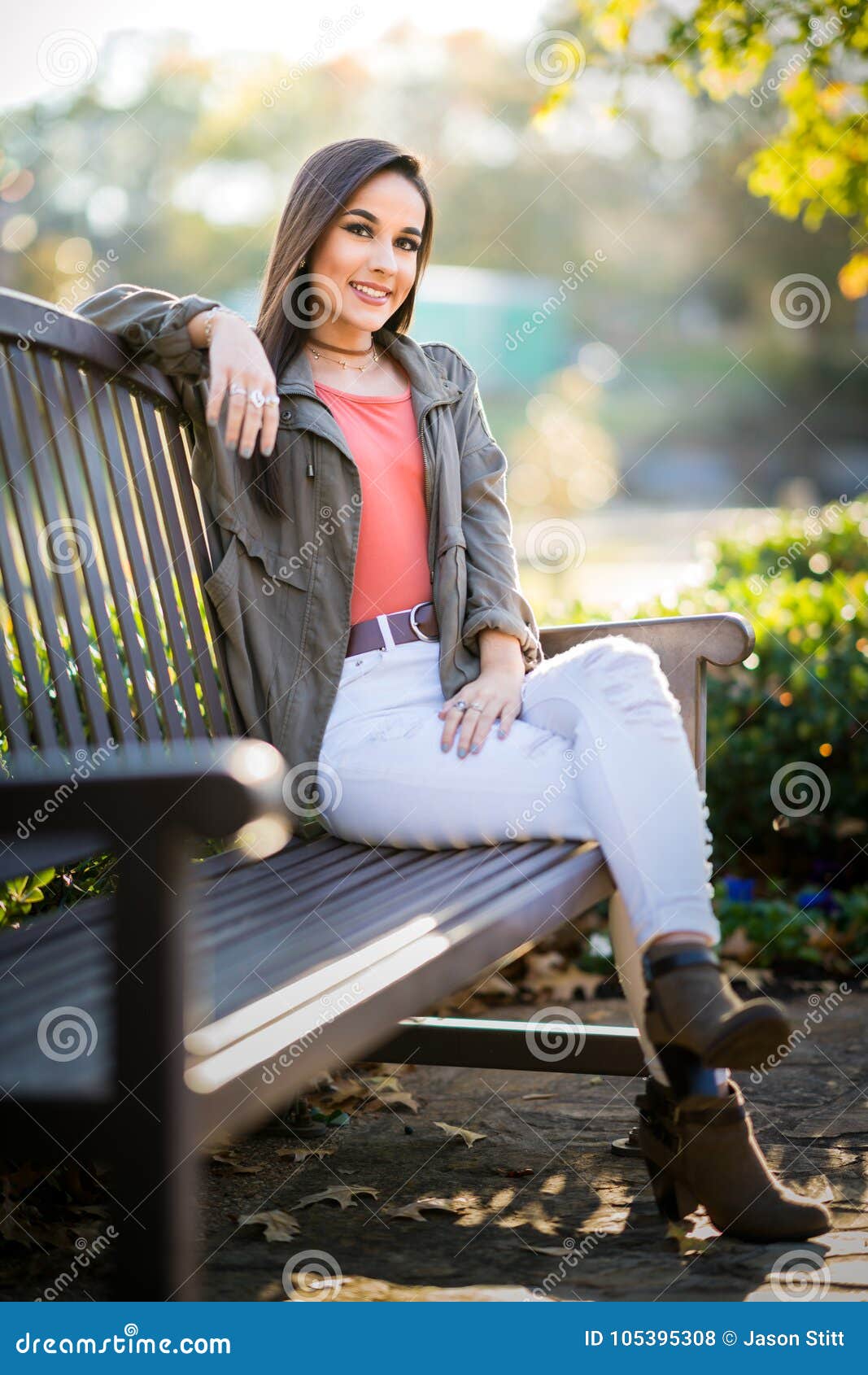 Woman Sitting on Bench stock photo. Image of young, smile - 105395308