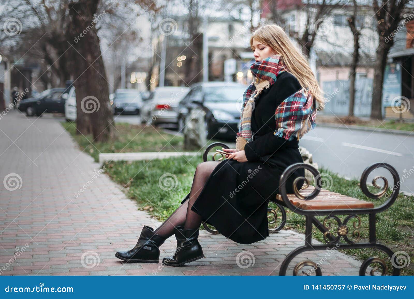 Woman Sitting on Bench in City Stock Image - Image of woman, style ...