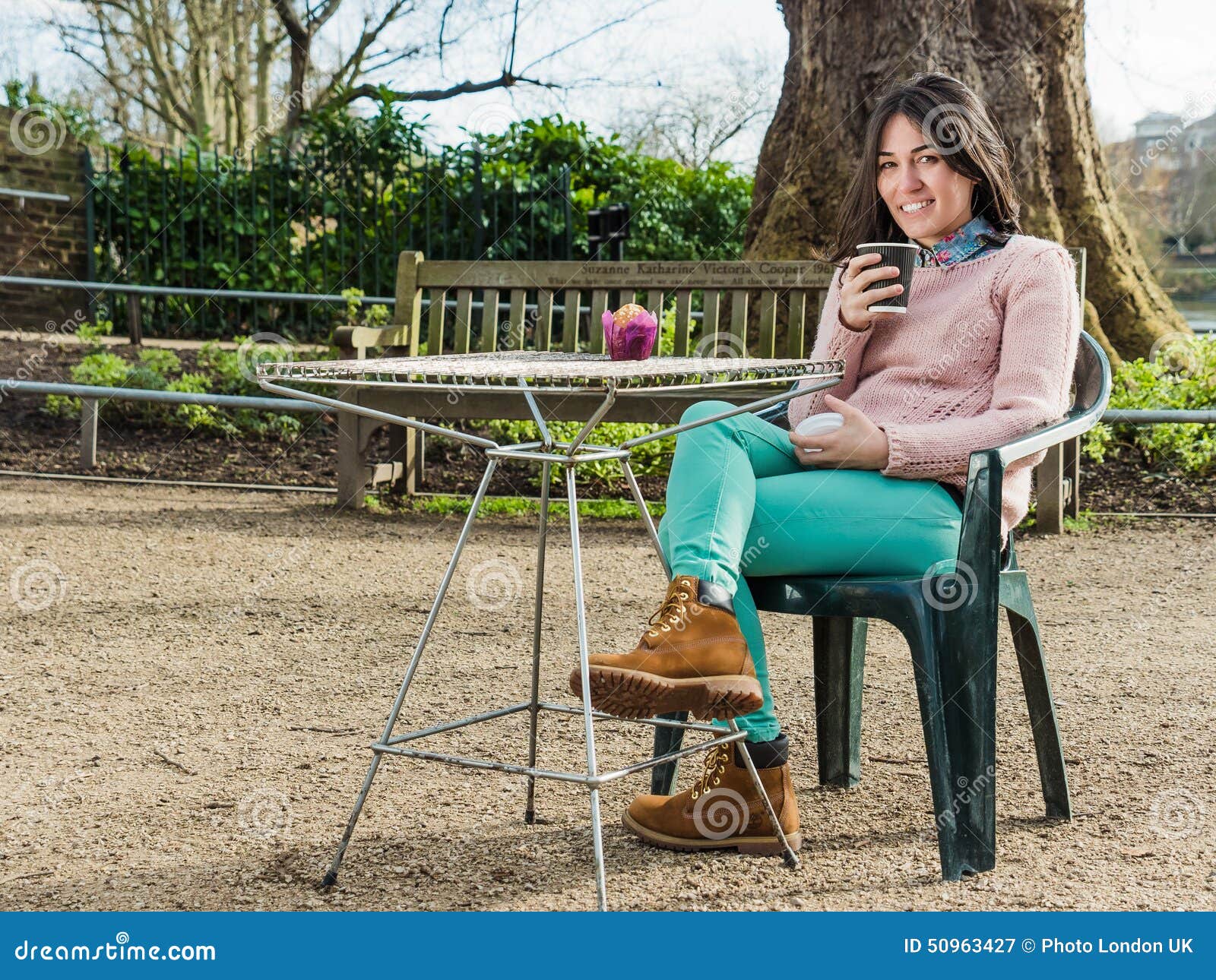 Woman Sitting in a Cafe and Looking at Camera with a Smile Stock Image ...