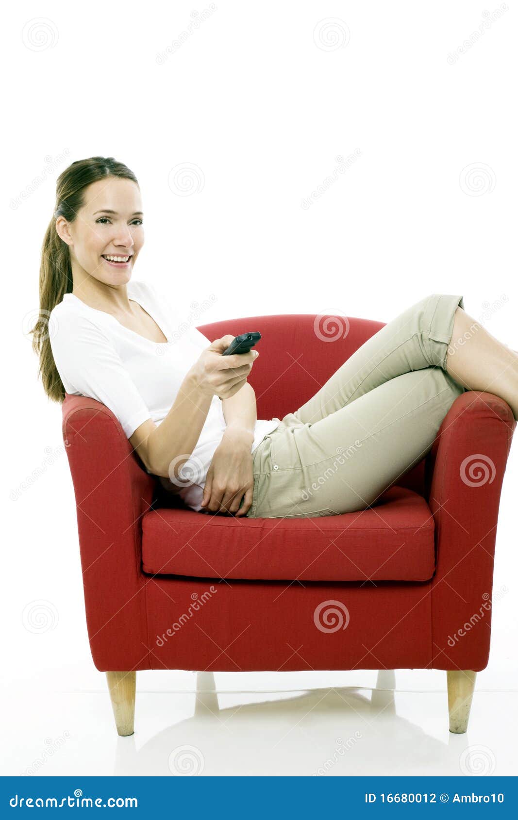 Woman Sitting on a Chair with Remote Control Stock Photo - Image of ...