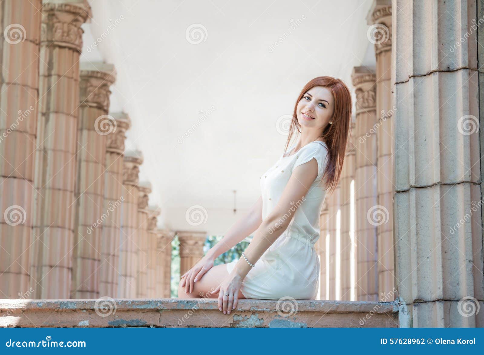 Woman Sitting between Columns Stock Photo - Image of accessories ...