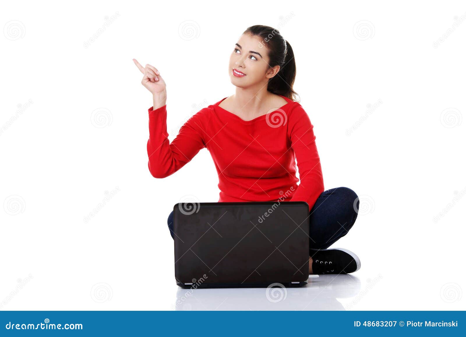 Woman Sitting Cross-legged Pointing Up Stock Image - Image of enjoy ...