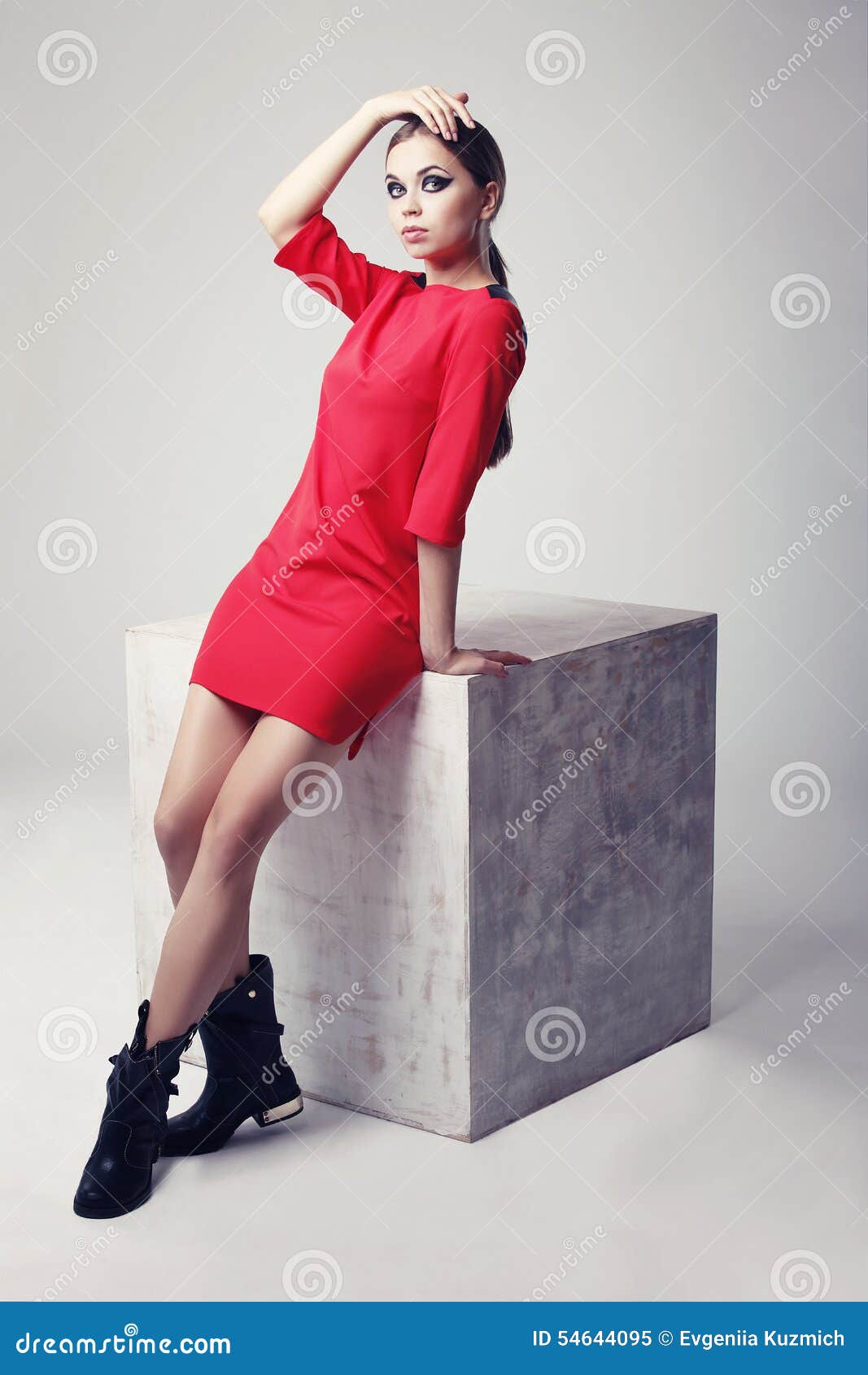 Woman sitting on cube stock image. Image of person, style - 54644095